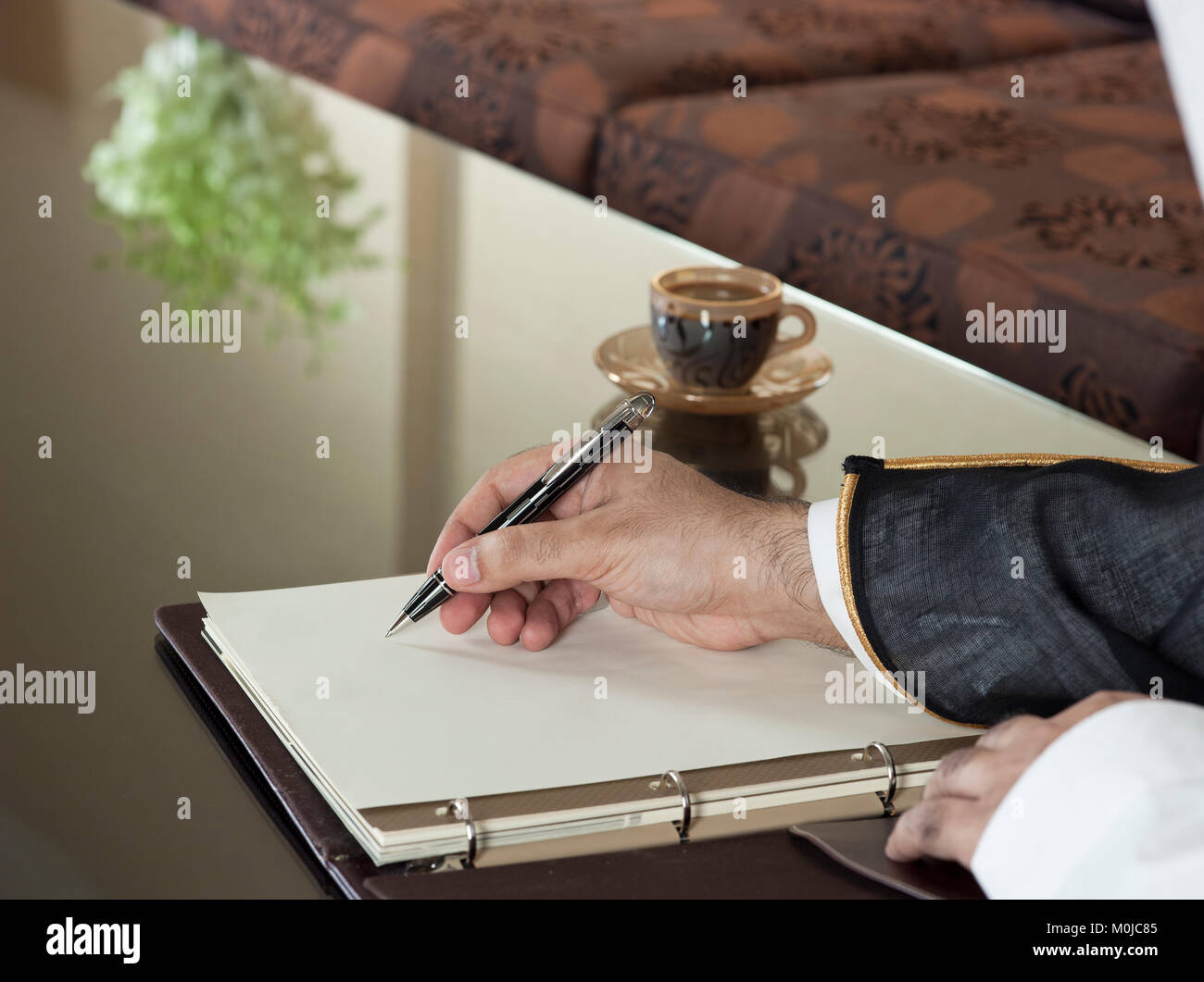 Saudi Arabian Man Hand Writing on A Notebook in a Luxury Home ...