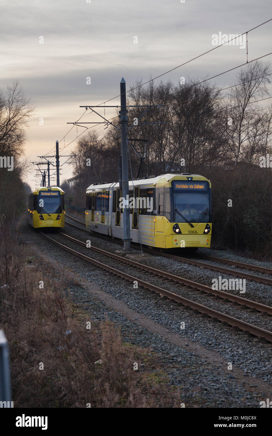Metrolink trams pass at Holinwood (between Manchester Victoria & Oldham ...