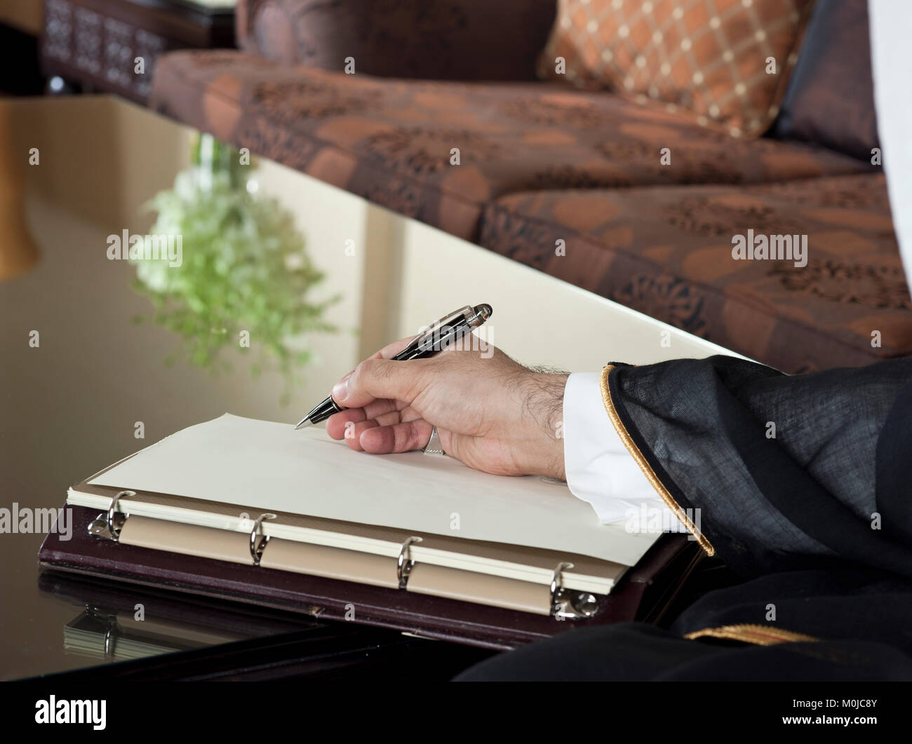 Saudi Arabian Man Hand Writing on A Notebook in a Luxury Home ...