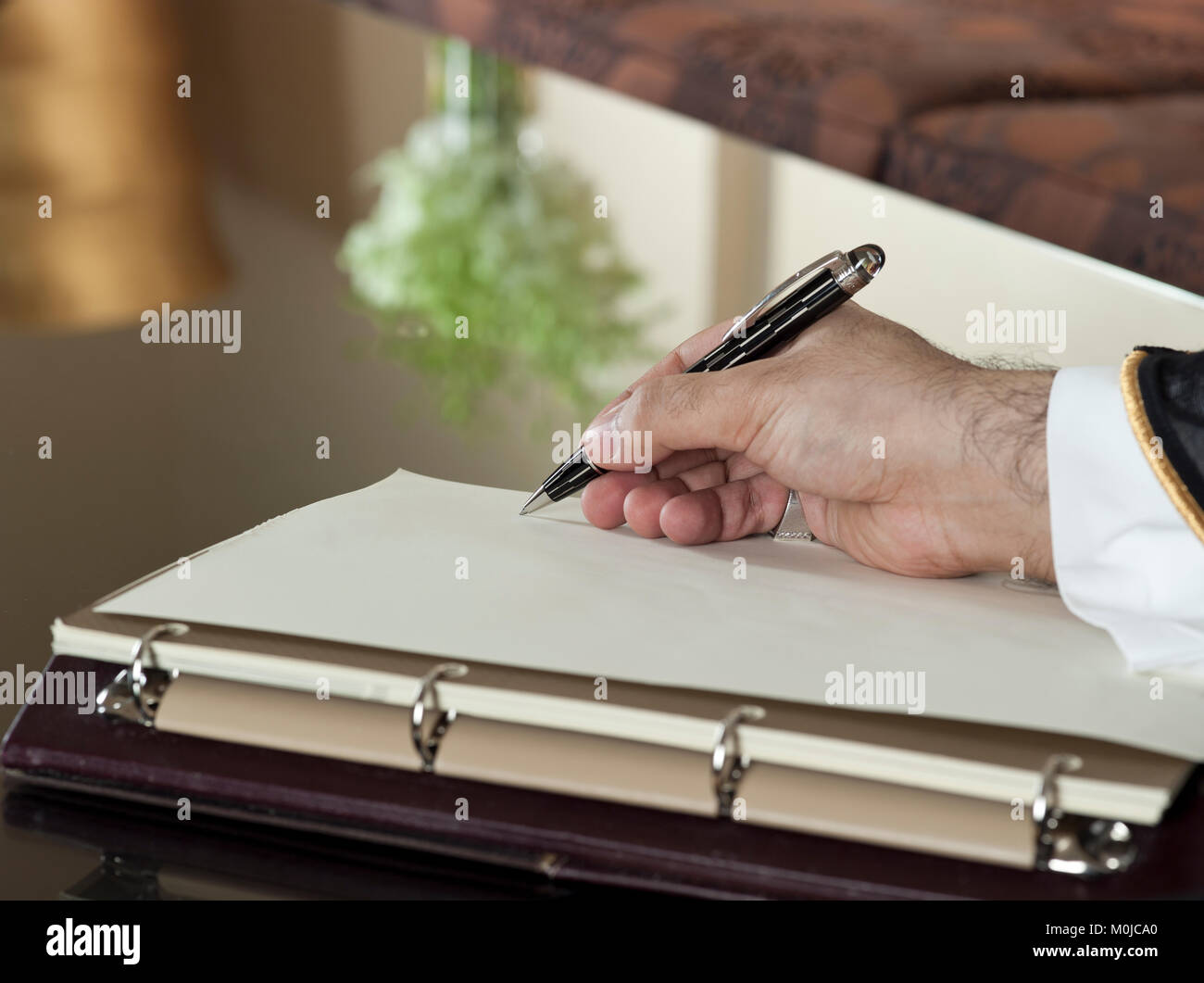 Saudi Arabian Man Hand Writing on A Notebook in a Luxury Home ...