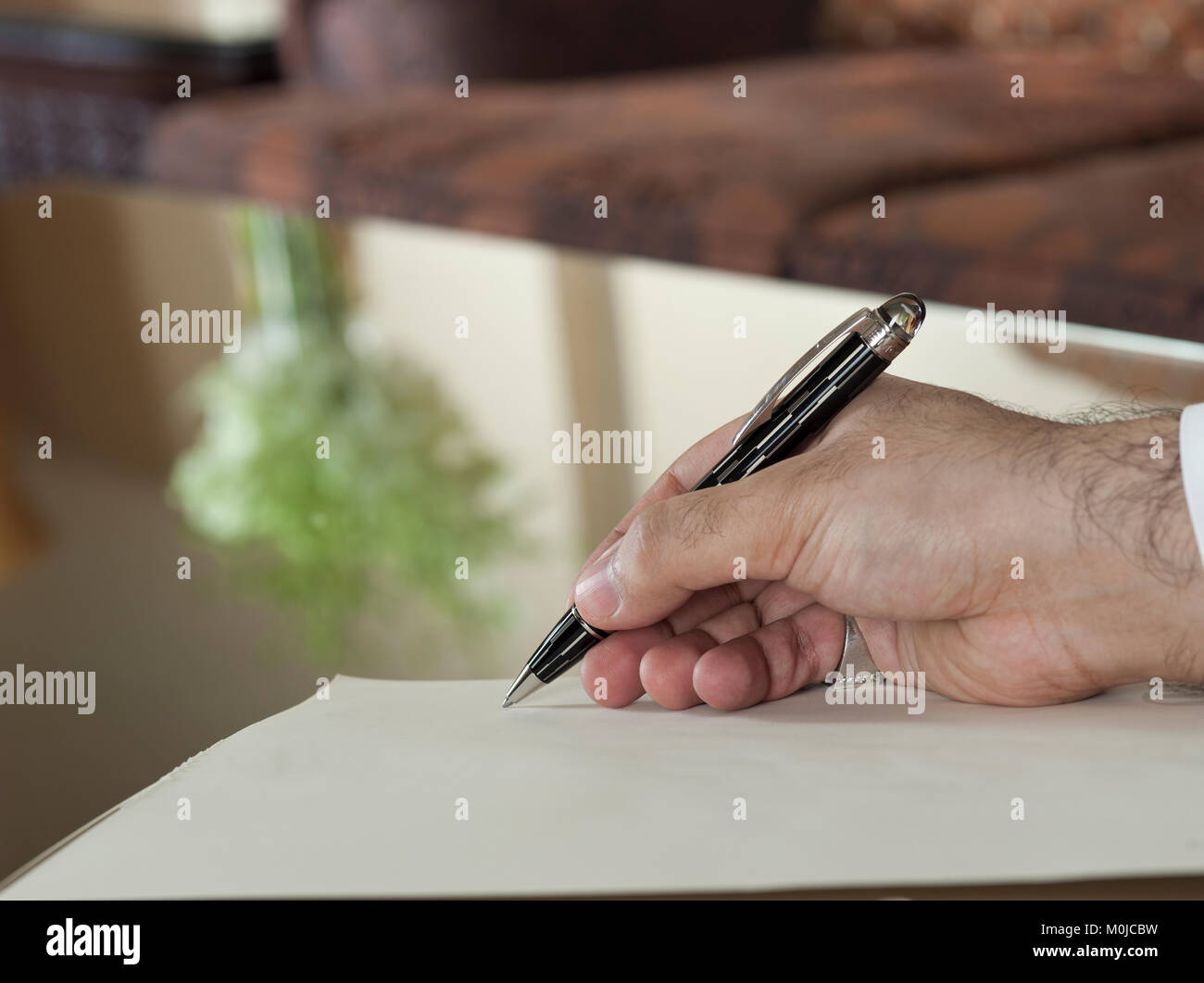 Saudi Arabian Man Hand Writing on A Notebook in a Luxury Home ...