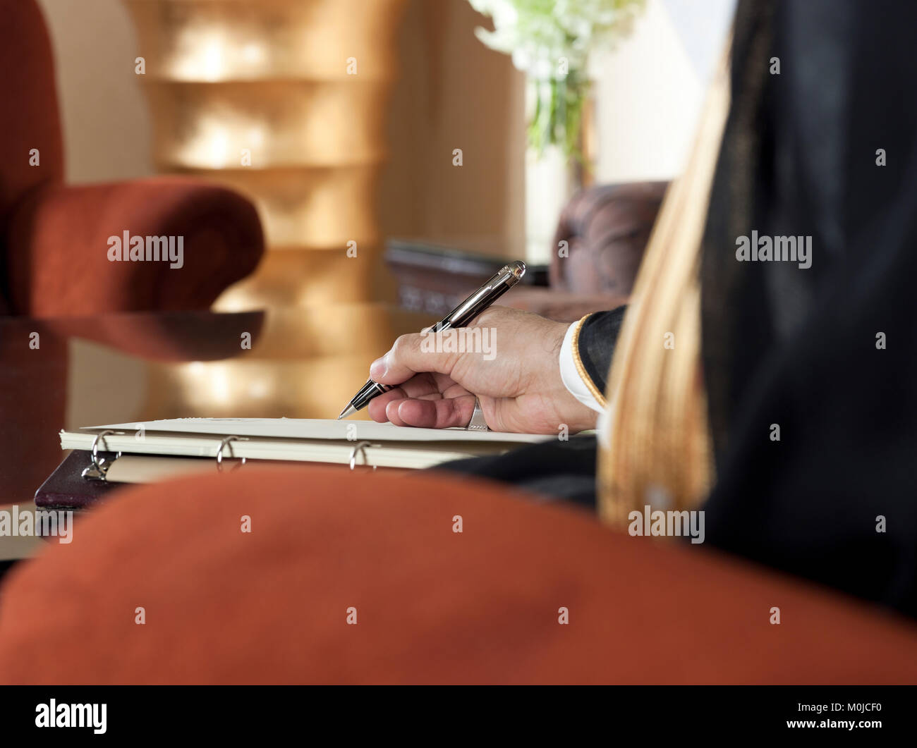 Saudi Arabian Man Hand Writing on A Notebook in a Luxury Home ...