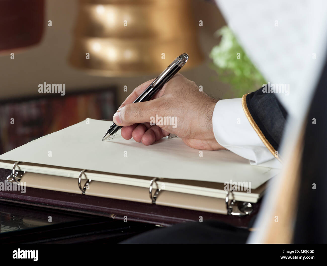 Saudi Arabian Man Hand Writing on A Notebook in a Luxury Home ...