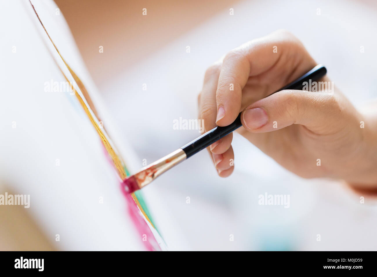 hand of artist with brush painting picture Stock Photo - Alamy