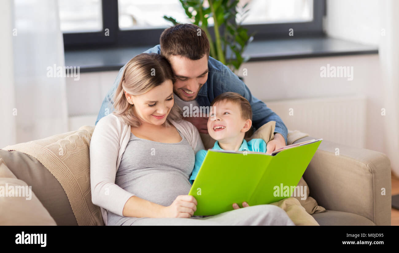 happy family reading book at home Stock Photo - Alamy