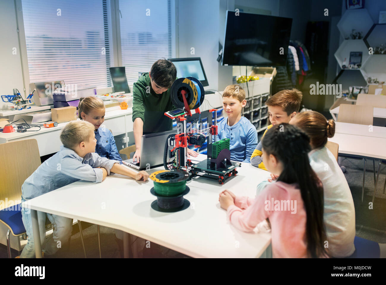 happy children with 3d printer at robotics school Stock Photo - Alamy