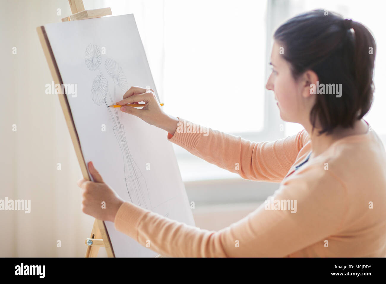artist with pencil drawing picture at art studio Stock Photo - Alamy