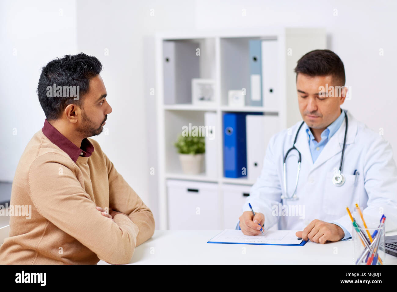 doctor and male patient meeting at hospital Stock Photo - Alamy