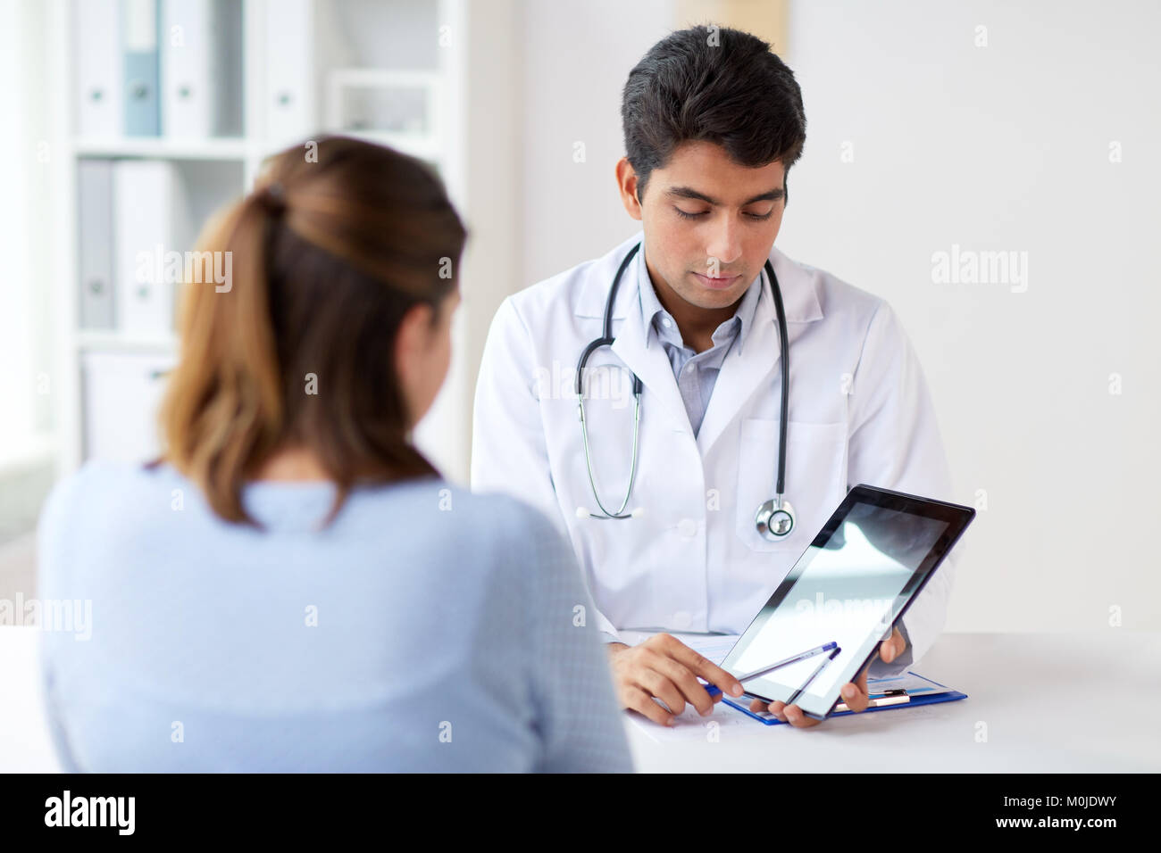 Doctor patient pc tablet technology hi-res stock photography and images ...