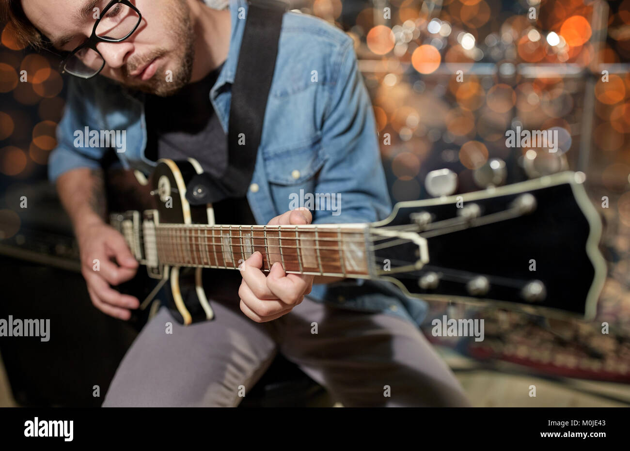 musician playing guitar at studio or music concert Stock Photo - Alamy