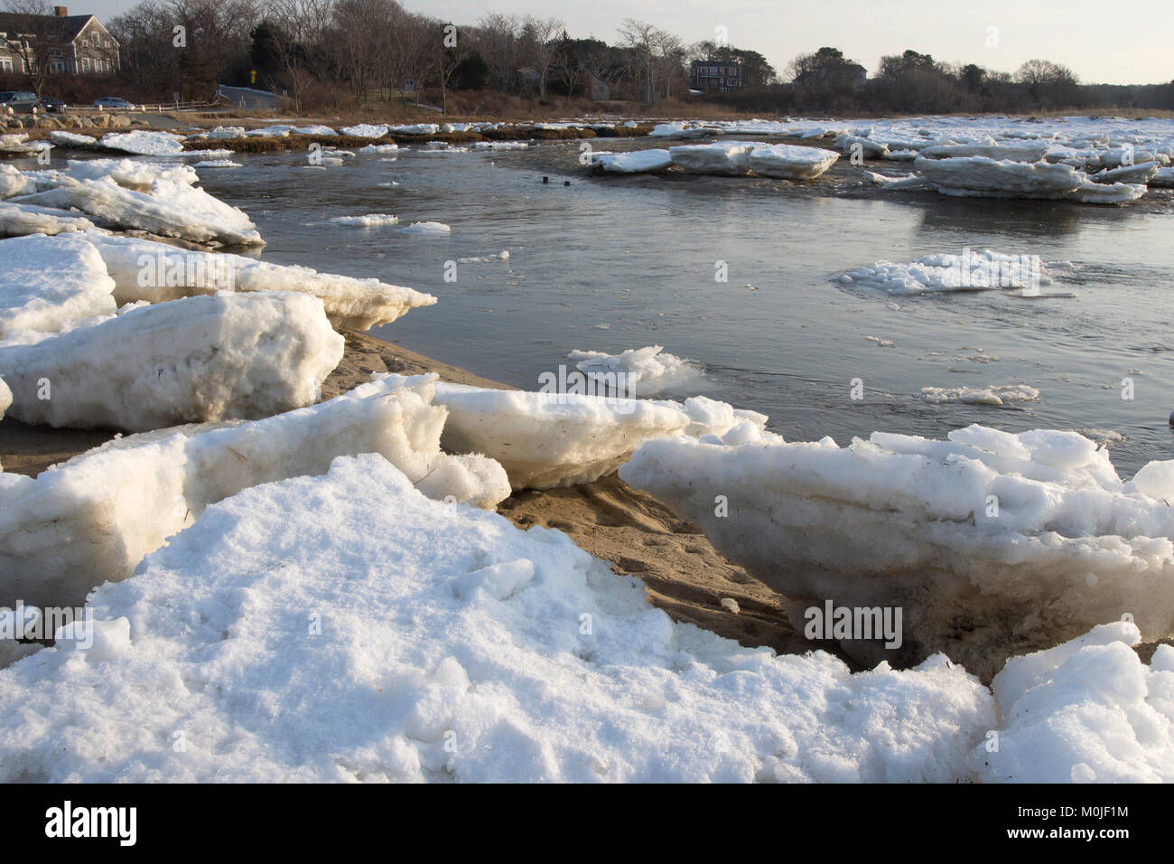 The icy shoreline of Cape Cod Bay in Brewster, Massachusetts, USA on a ...