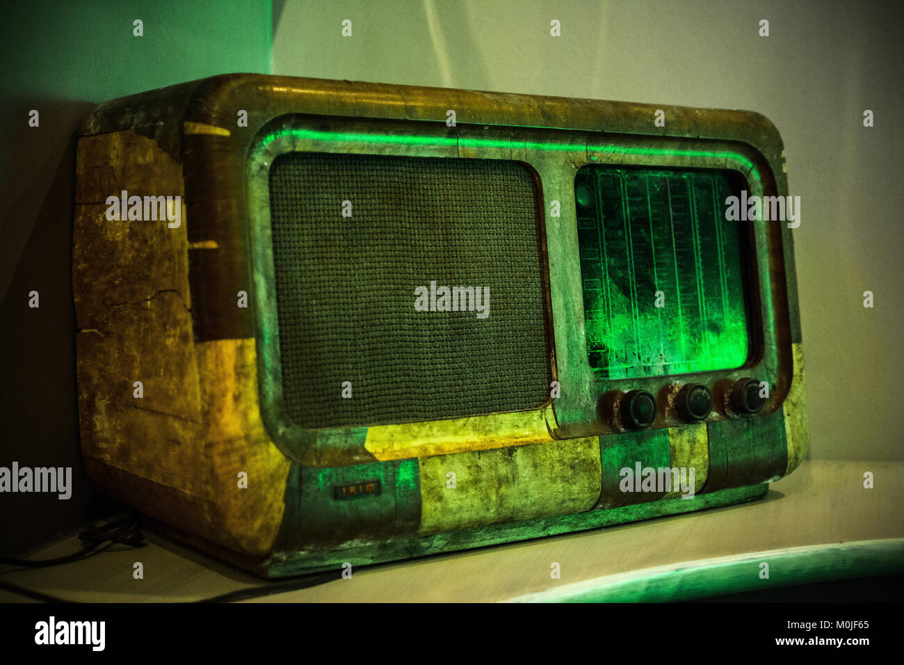 Old radio illuminated with a green light in a club Stock Photo - Alamy