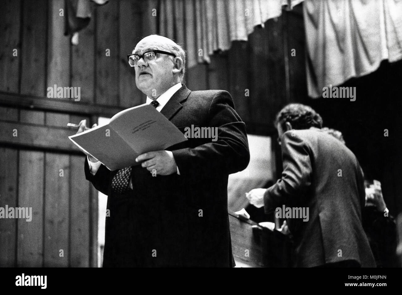 Adjudicator judging on stage performance at village hall small ...