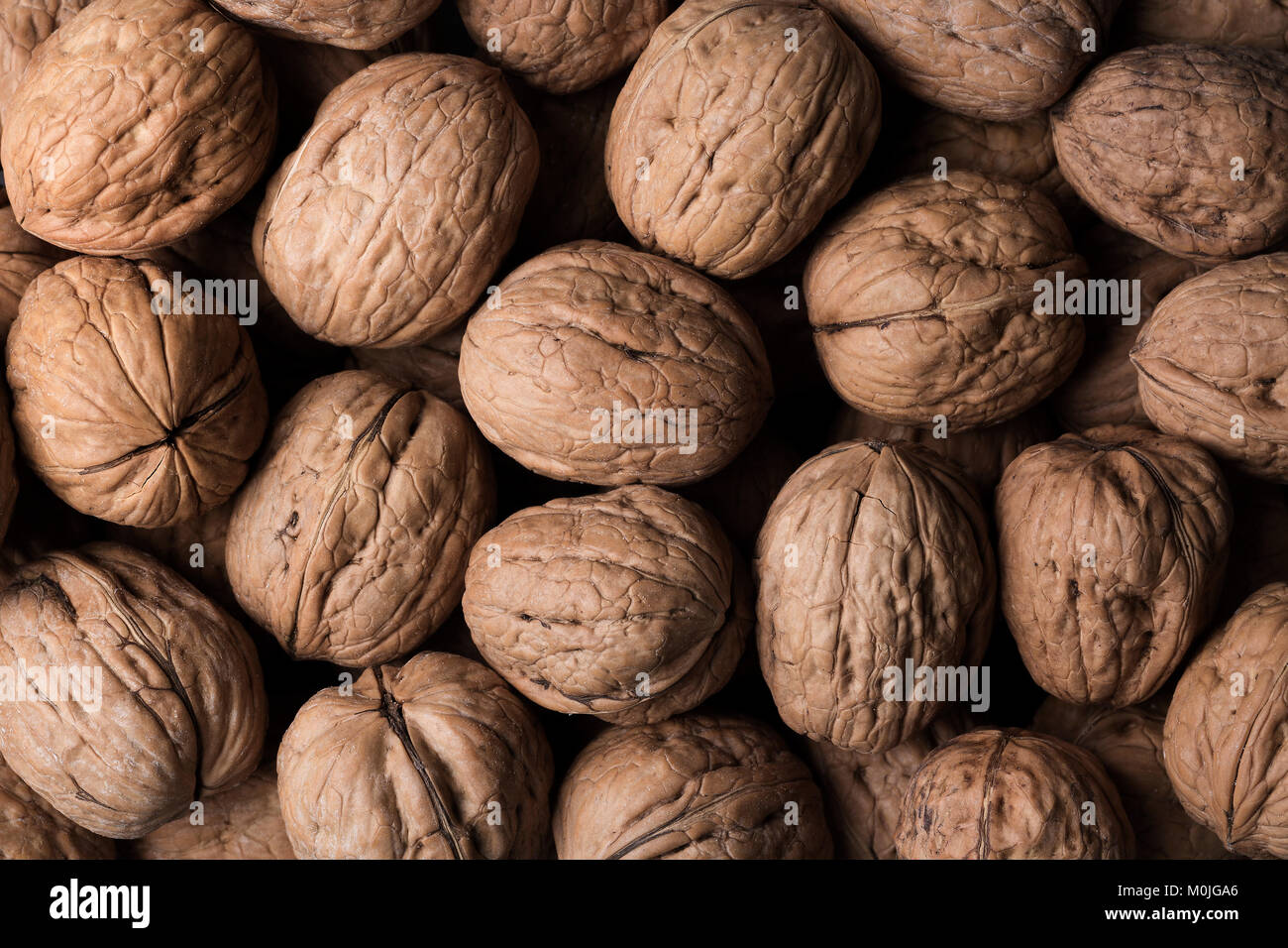 A detailed background of walnuts Stock Photo - Alamy