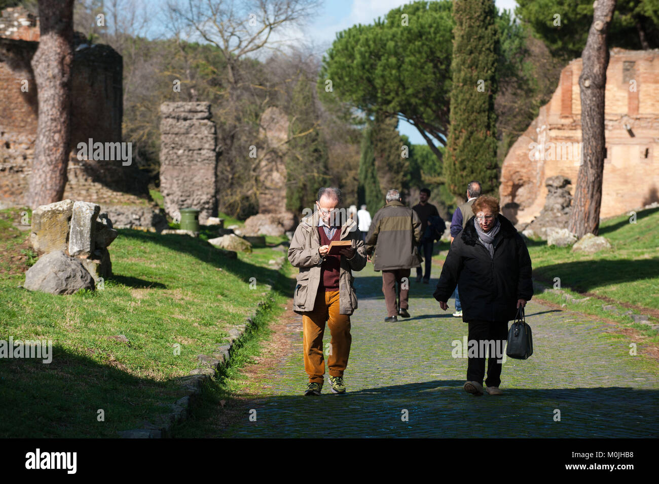 Rome, Italy. Tourists walking in via Appia Antica Stock Photo - Alamy