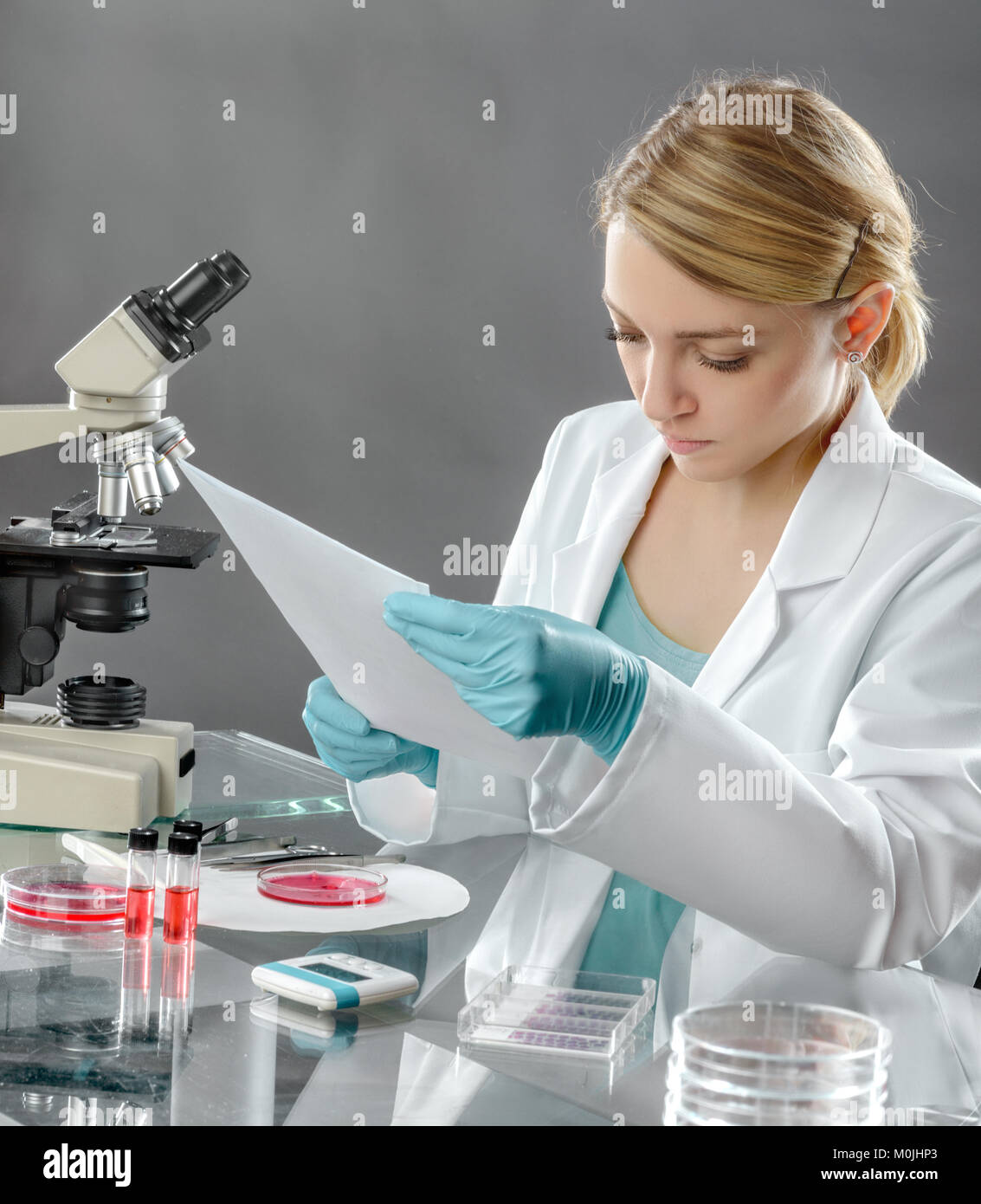Young female scientist works in modern laboratory Stock Photo - Alamy