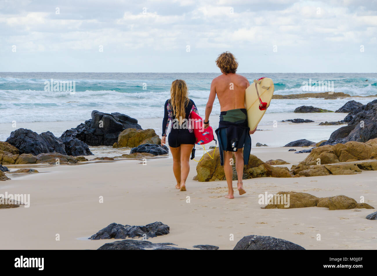 Gold coast beach australia man woman hi-res stock photography and ...