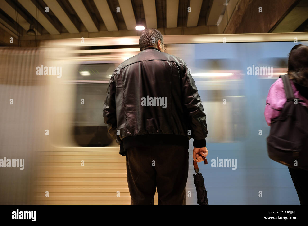 people waiting for the train at a subway station platform, train ...