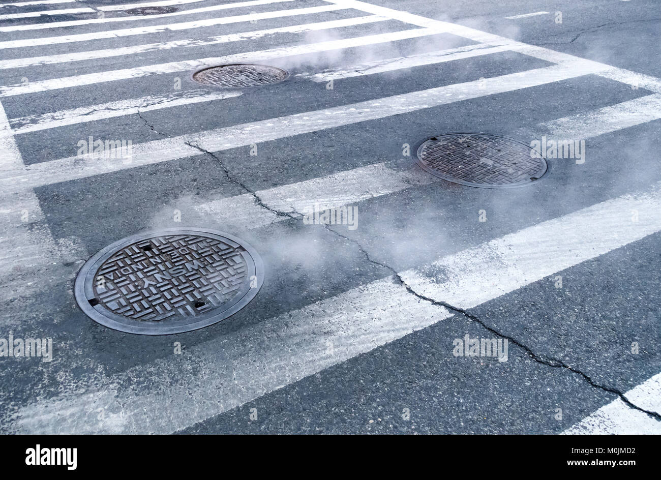 Steam coming from manhole covers in New York City Stock Photo - Alamy