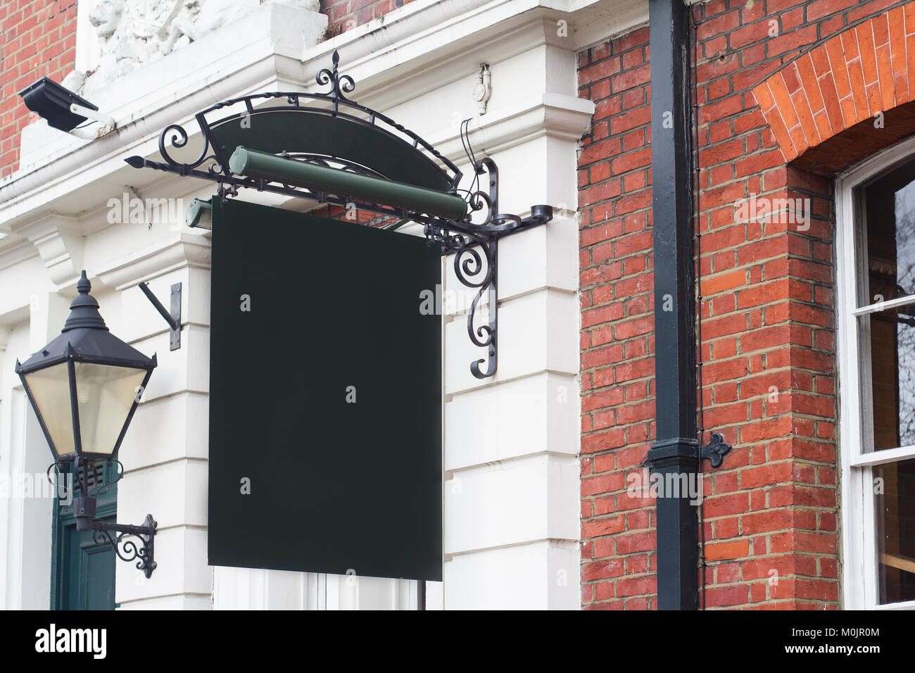 Horizontal side view of empty black square signage on a British ...