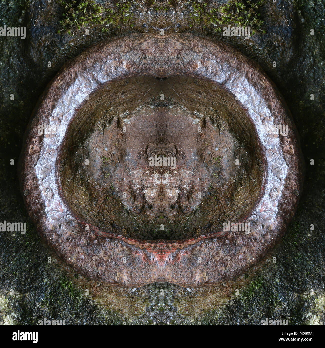 Old rusty iron ring on rock - detail Stock Photo - Alamy