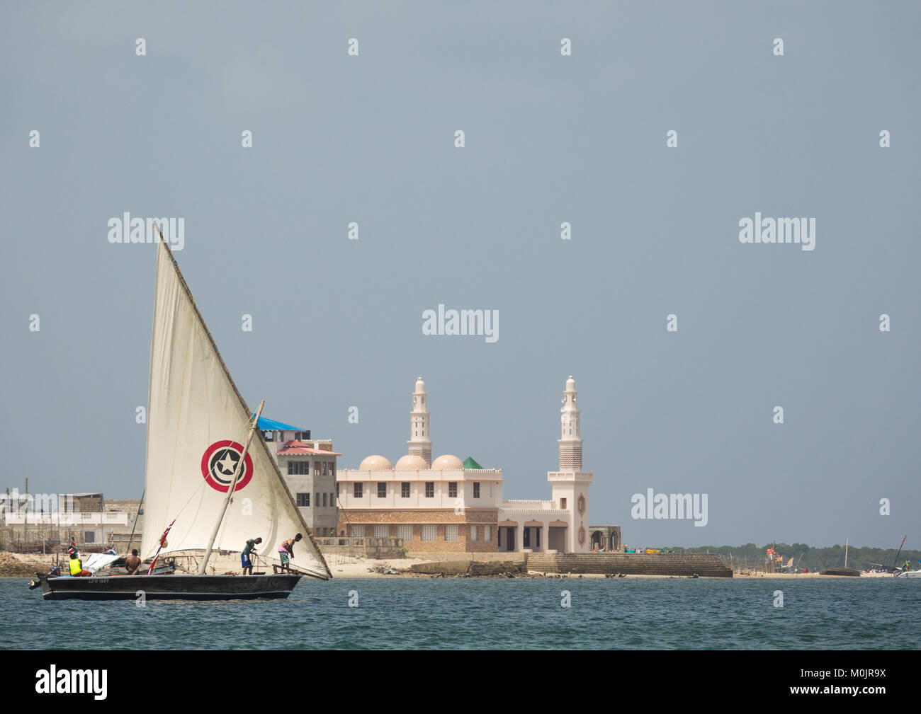 Dhow sailing in front of the new Lamu mosque, Lamu, Lamu Archipelago ...