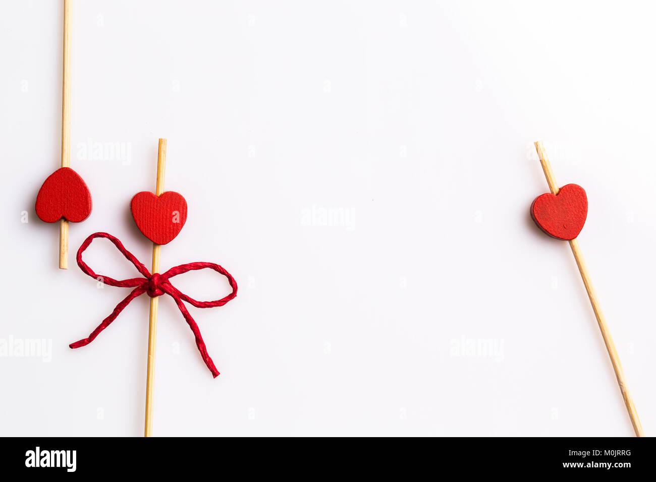 Three handmade heart cupcake toppers on white background Stock Photo ...