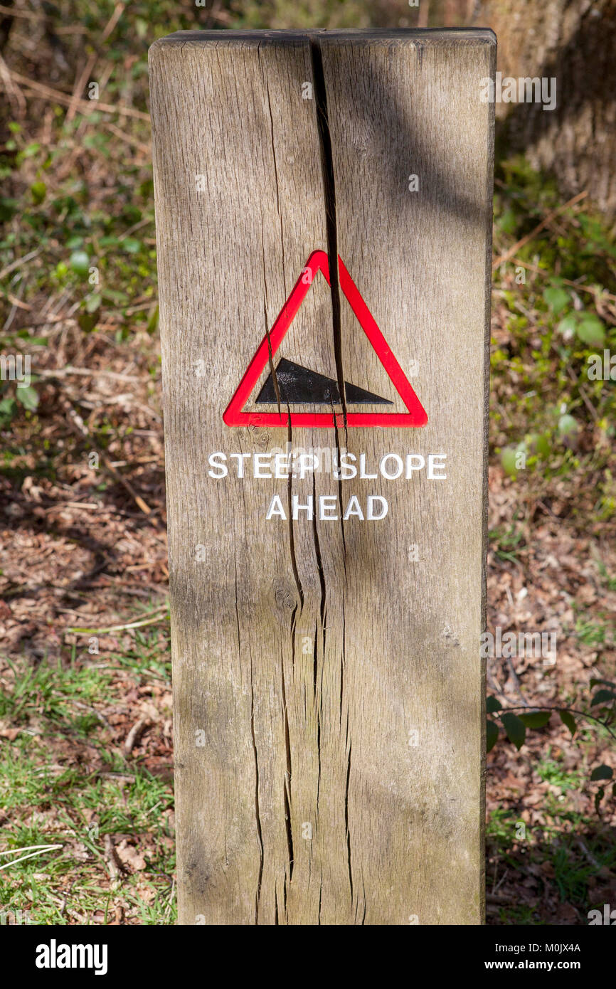 Steep slope ahead sign on a wooden post Stock Photo - Alamy