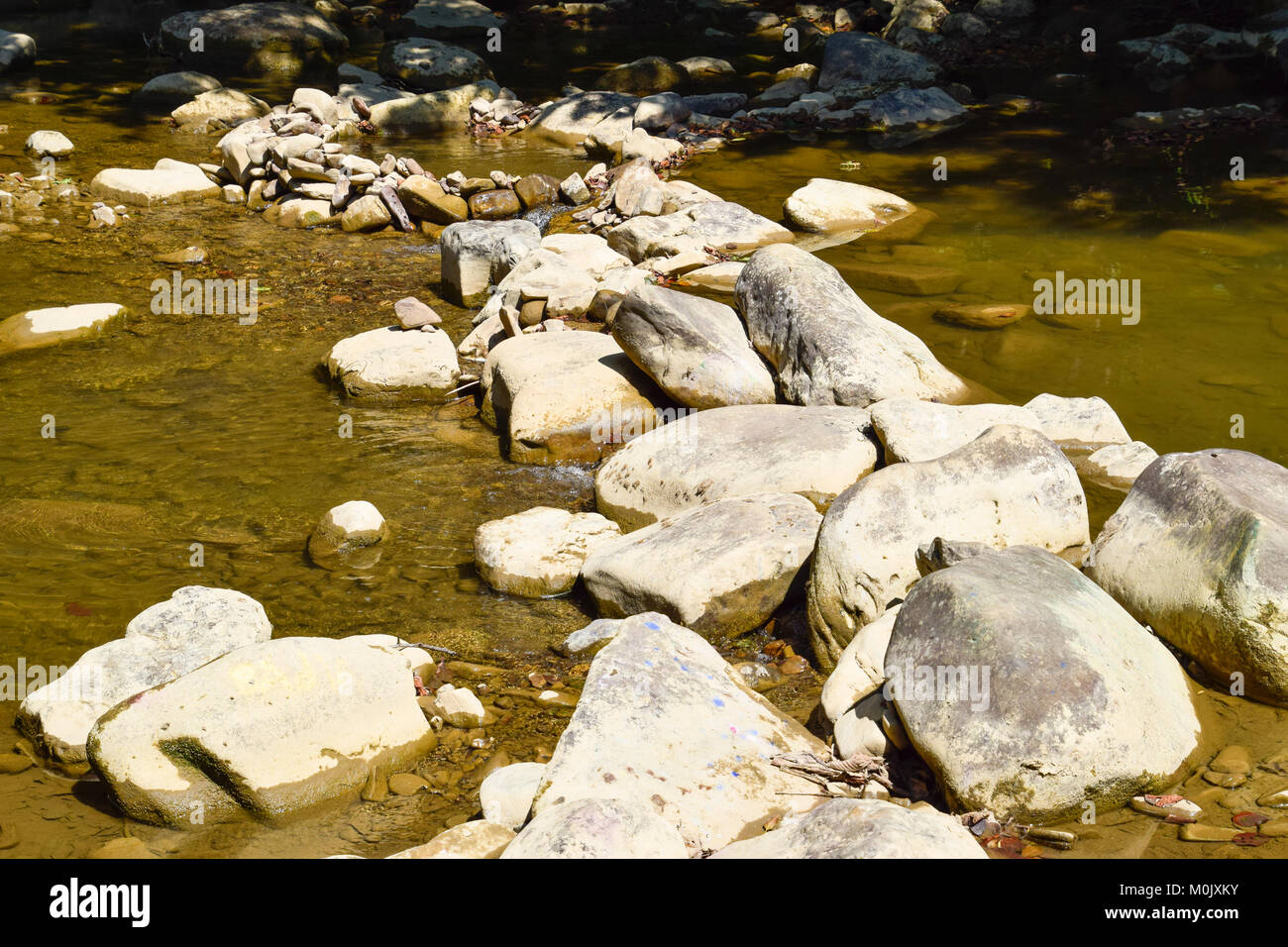 The mountain river. Shallow mountain river, water flows through the ...