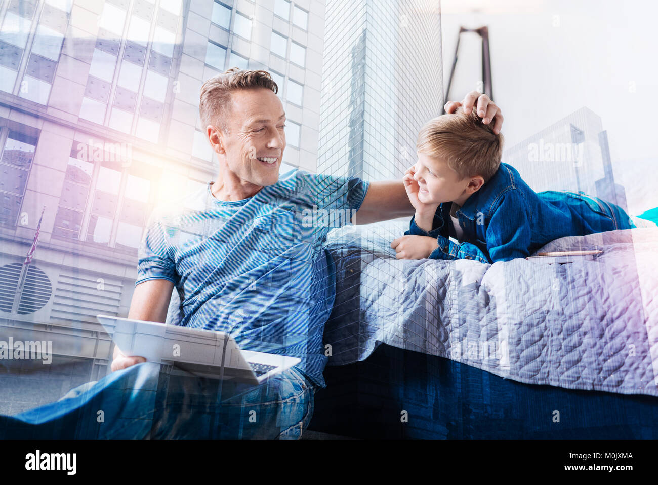 Happy father looking at his son Stock Photo - Alamy