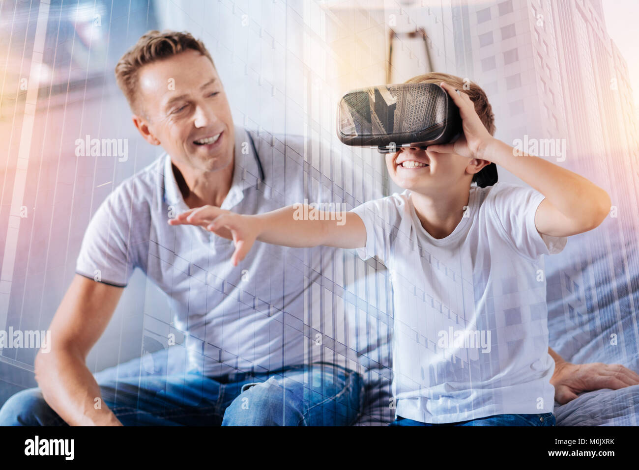 Handsome man looking at his son Stock Photo - Alamy