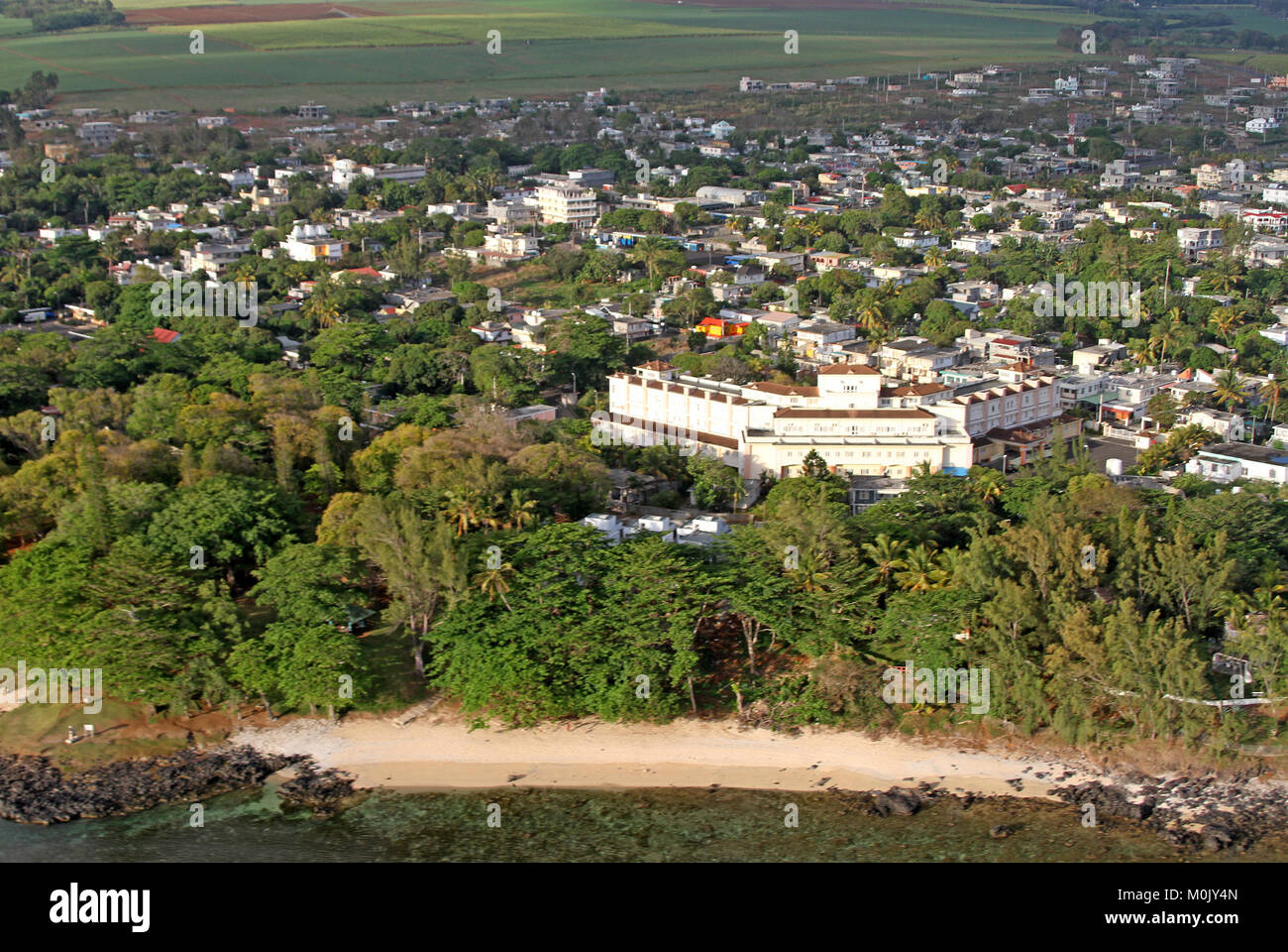 Town near beach seen from helicopter, Savanne district, Republic of ...