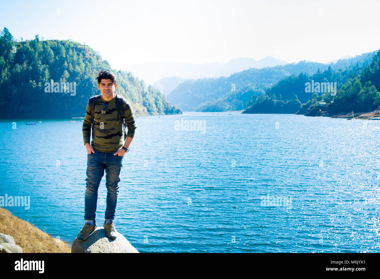 Hiking man arms open to nature view Stock Photo - Alamy