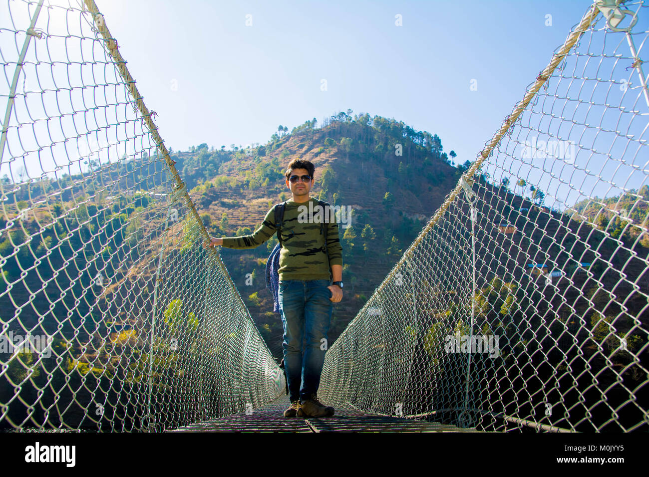 Man on Bridge Stock Photo - Alamy