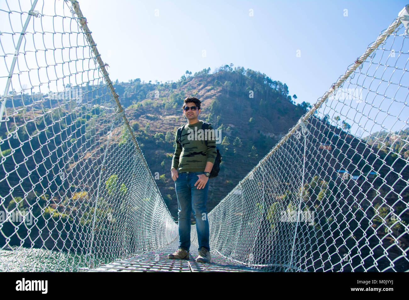 Boy crossing bridge hi-res stock photography and images - Alamy