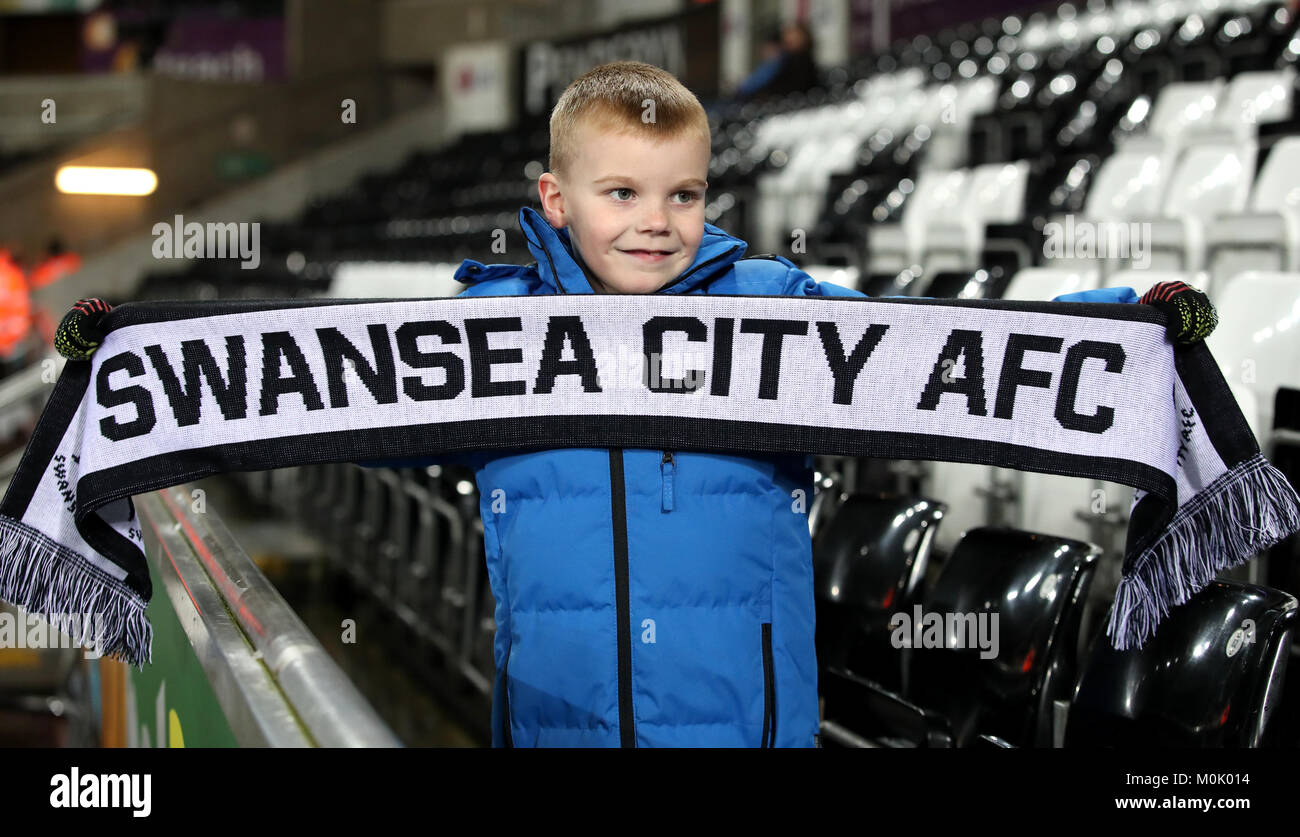 Swansea City fan Reece Jones poses for a photo prior to the Premier ...