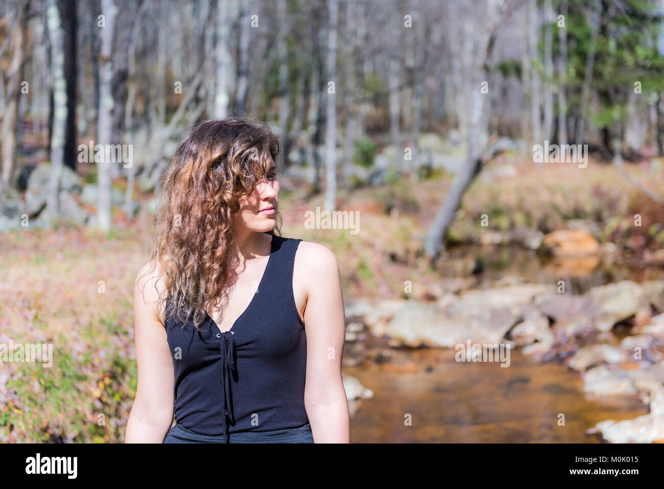 Closeup side profile portrait of young woman's happy smiling face in ...