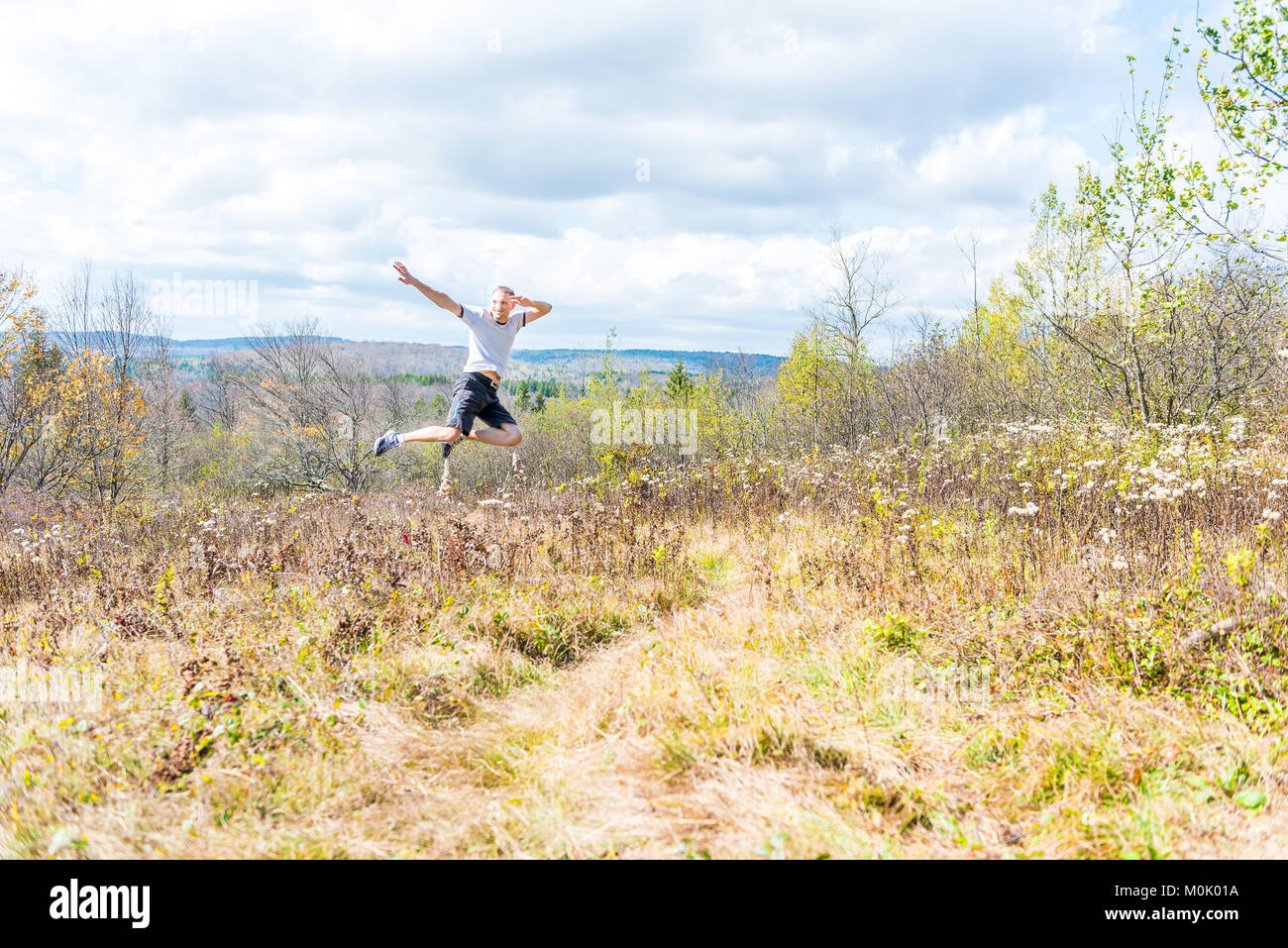 Mid air high jump hi-res stock photography and images - Alamy