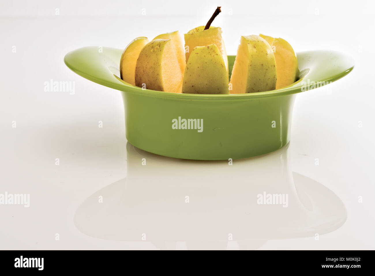 apple cut into wedges from below Stock Photo - Alamy
