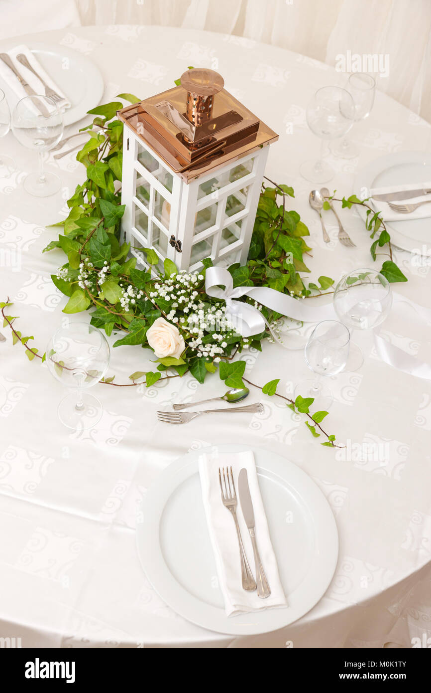 set up of a wedding table decorated with flowers Stock Photo - Alamy