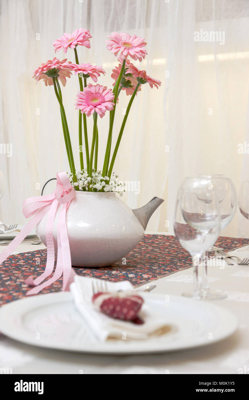 set up of a wedding table decorated with flowers Stock Photo - Alamy