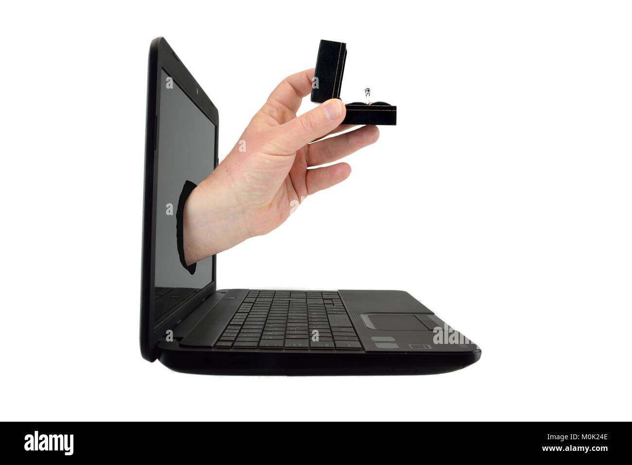 Concept of a computer and a male hand come out of the screen holding a ...