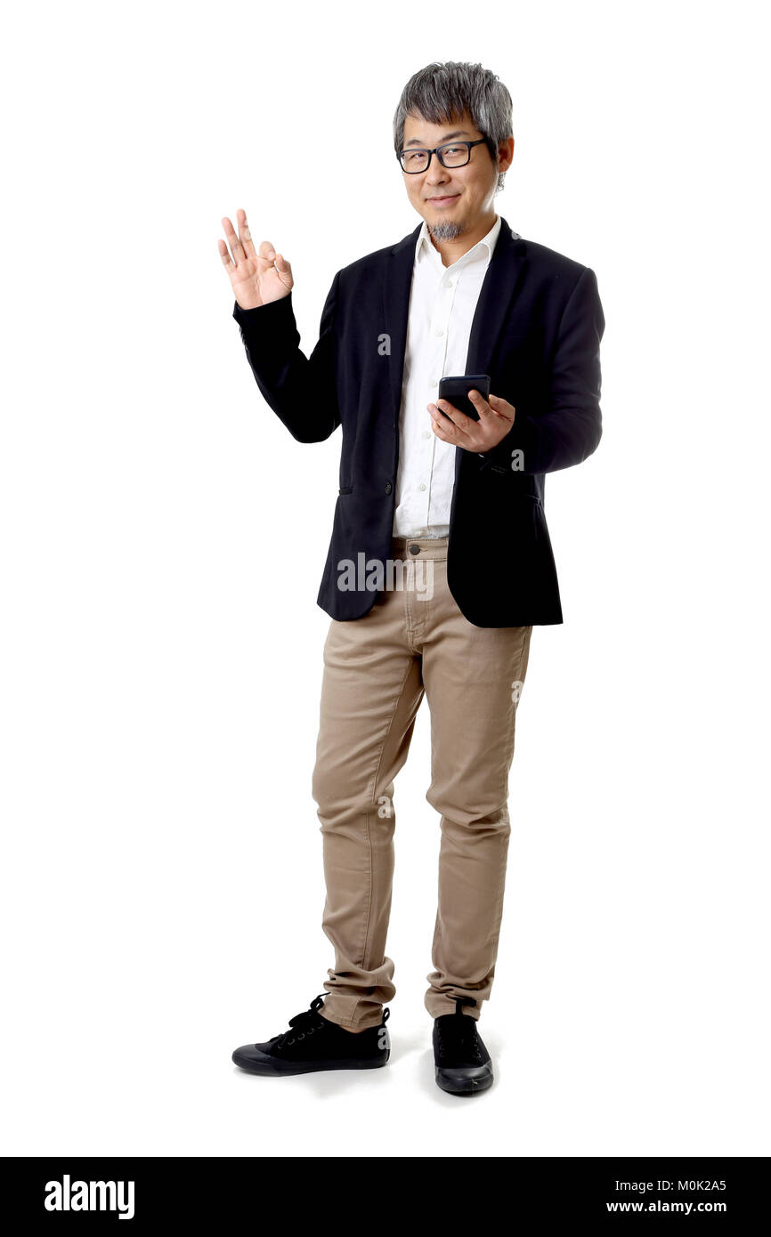 The Asian man standing on the white background Stock Photo - Alamy