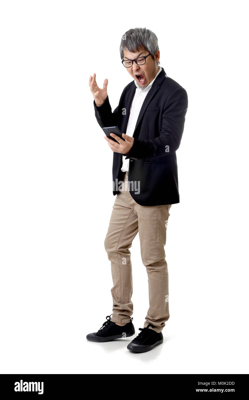 The Asian man standing on the white background Stock Photo - Alamy