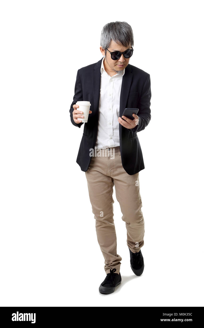 The Asian man standing on the white background Stock Photo - Alamy