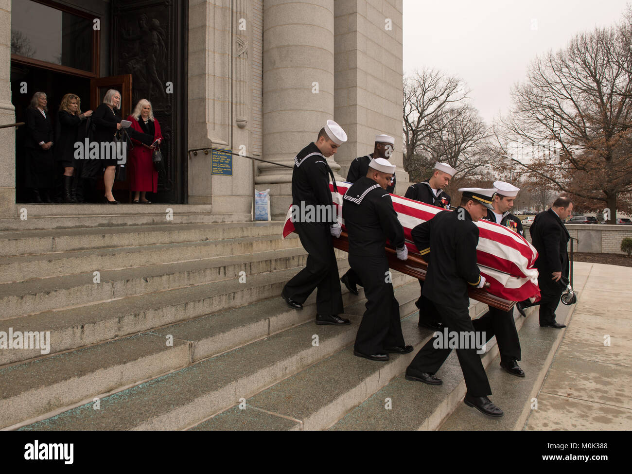 U.S. Navy sailor pallbearers carry the casket of former NASA astronaut ...