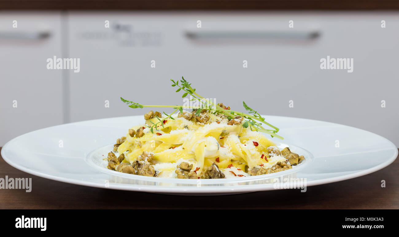 Pasta with White Cream and nuts Stock Photo - Alamy