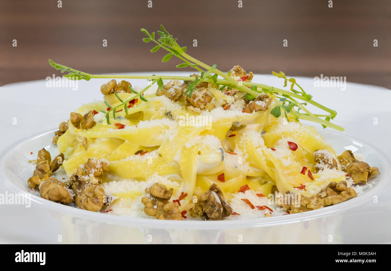 Pasta with White Cream and nuts Stock Photo - Alamy