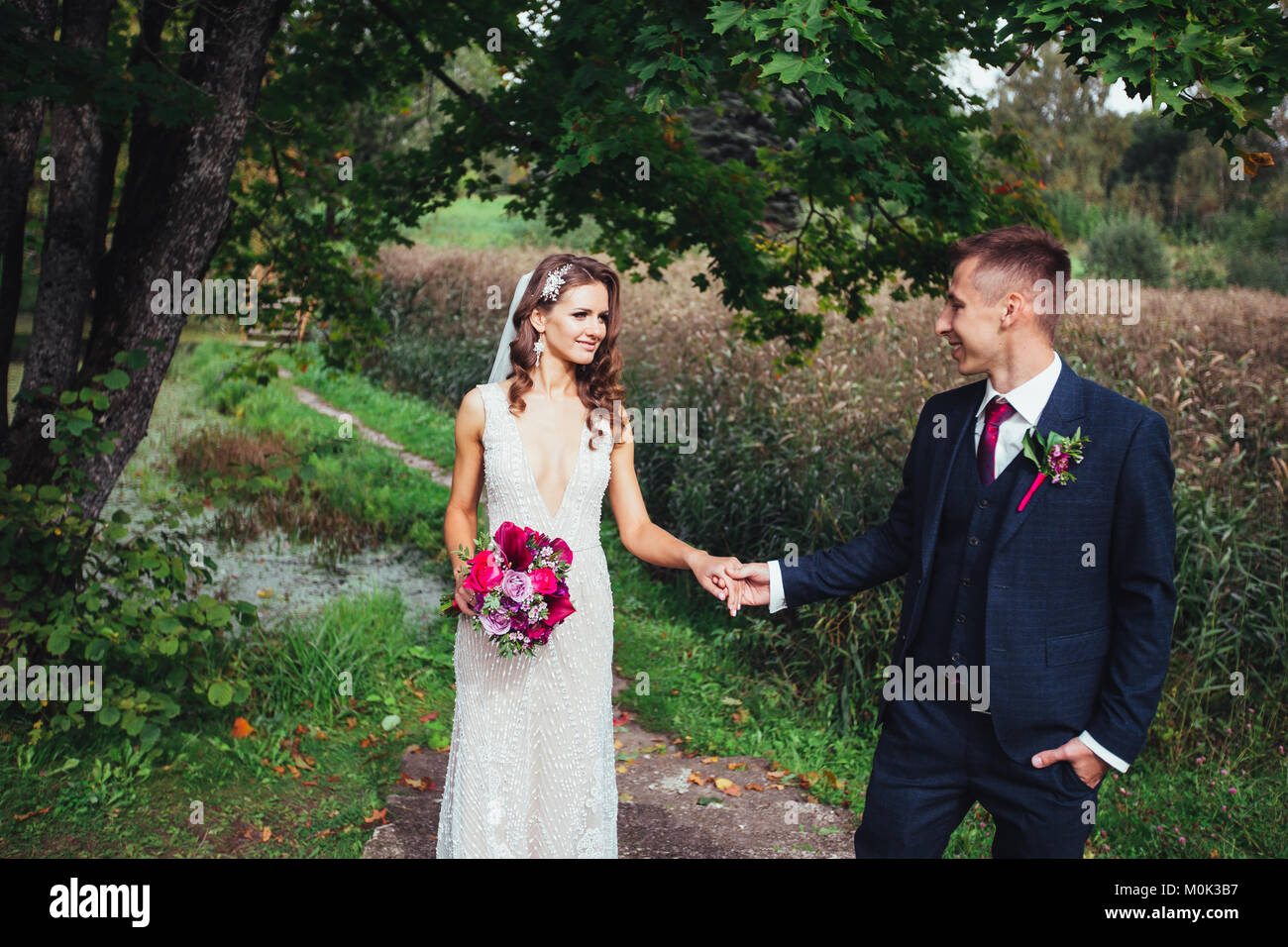 Just married .Groom and bride together. Wedding couple in park Stock ...
