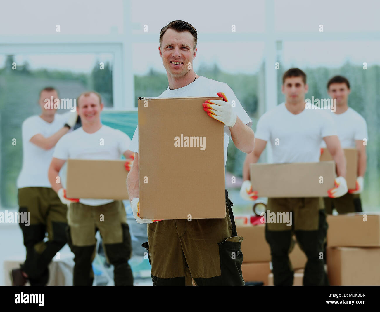 workers unload boxes Stock Photo - Alamy